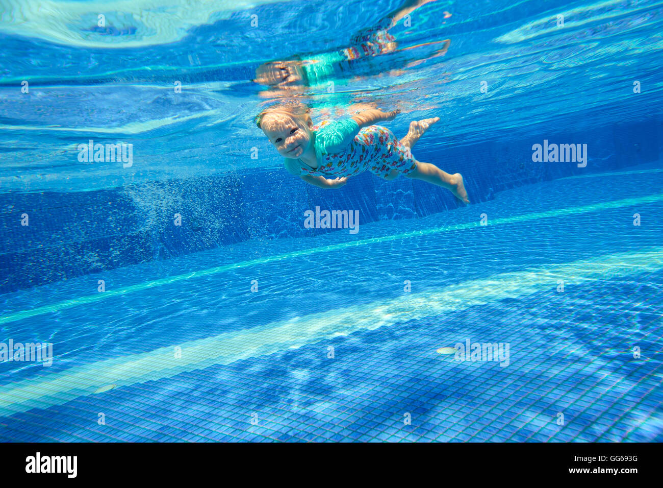 Girl diving underwater hi-res stock photography and images - Alamy