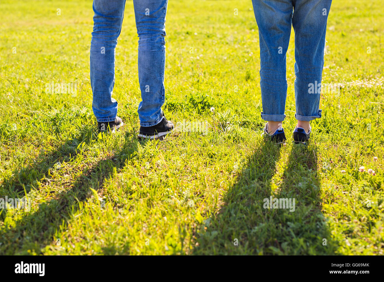 couple running in a field Stock Photo - Alamy