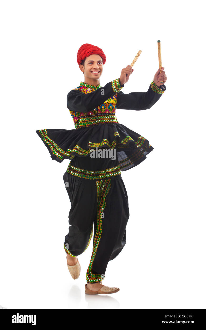 Male dandiya dancer dancing sticks hi-res stock photography and images ...