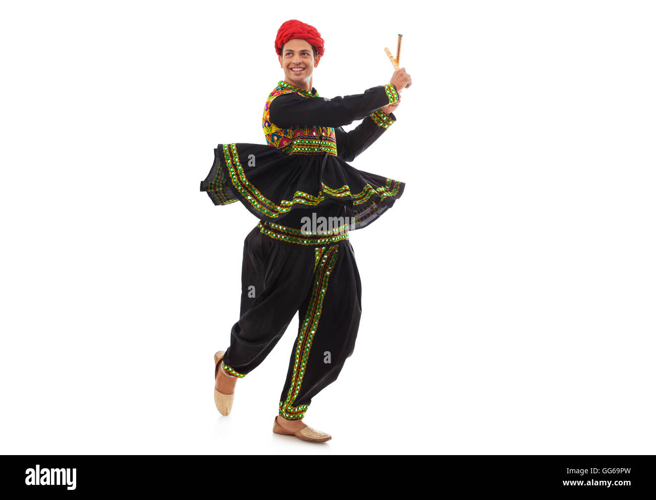 Male dandiya dancer dancing with sticks Stock Photo - Alamy