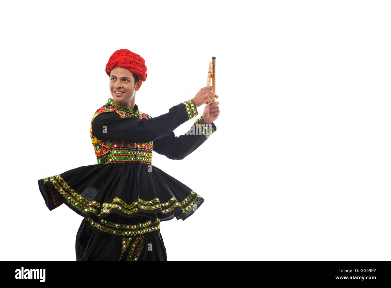 Male dandiya dancer dancing with sticks Stock Photo - Alamy