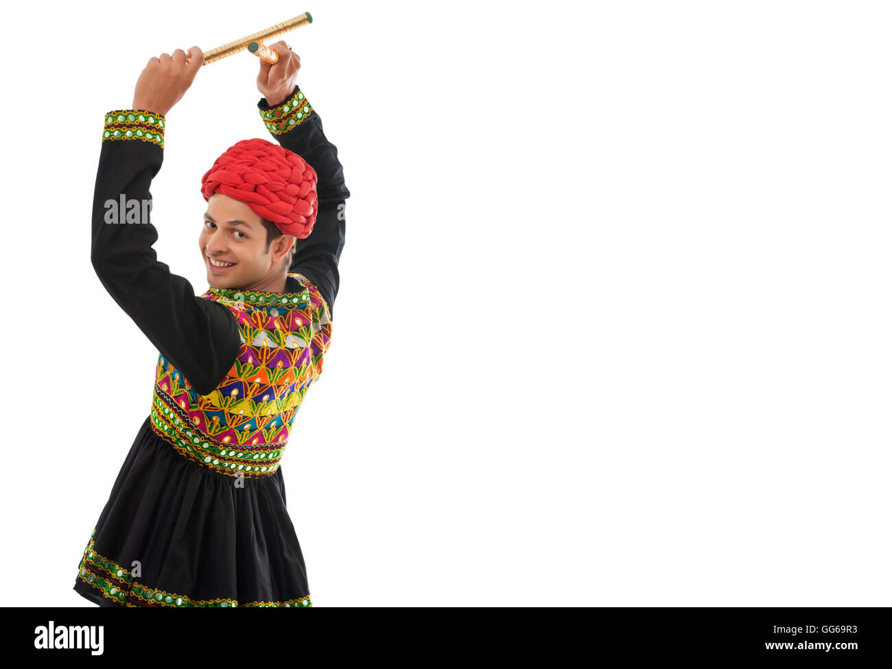 Male dandiya dancer dancing with sticks Stock Photo - Alamy