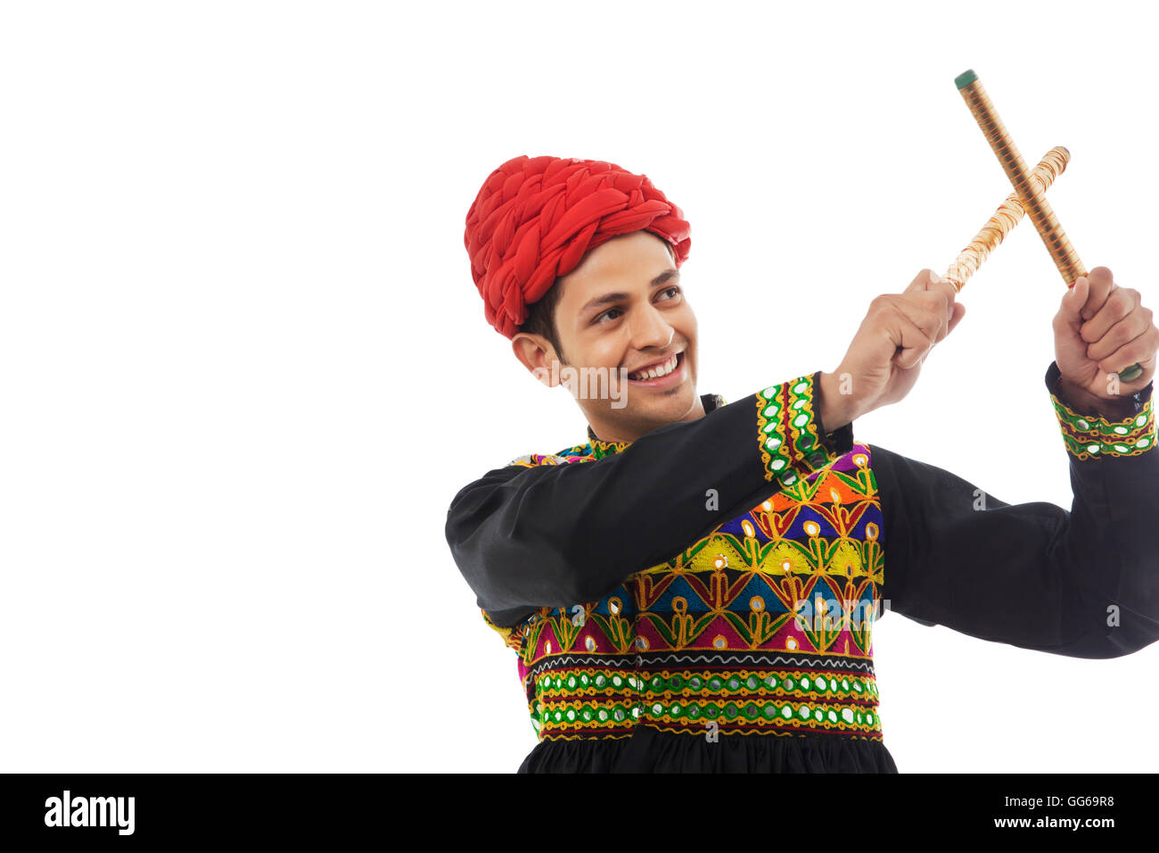 Male dandiya dancer dancing with sticks Stock Photo - Alamy