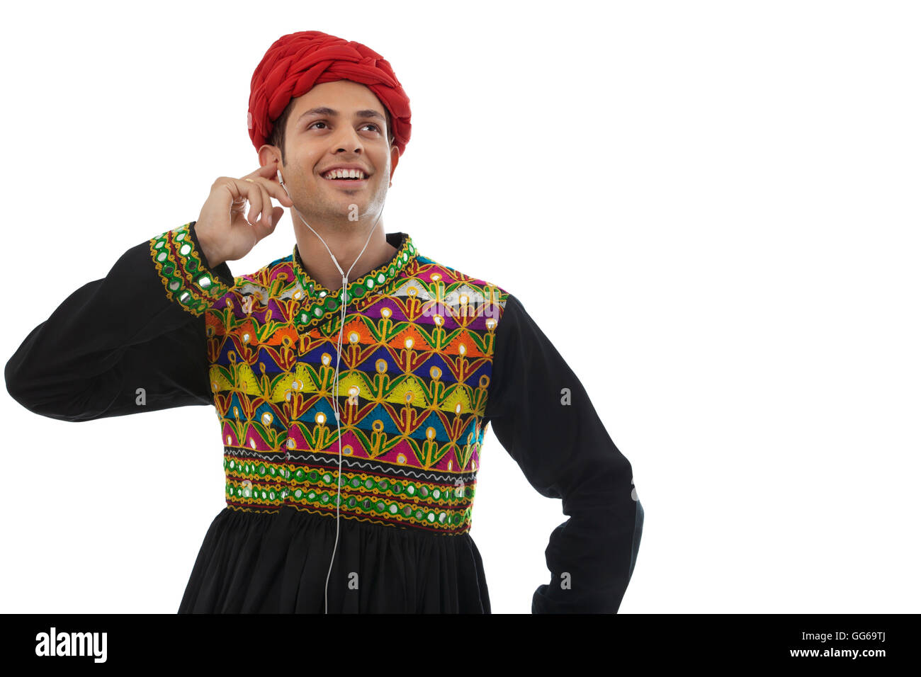 Male dandiya dancer listening to music Stock Photo - Alamy