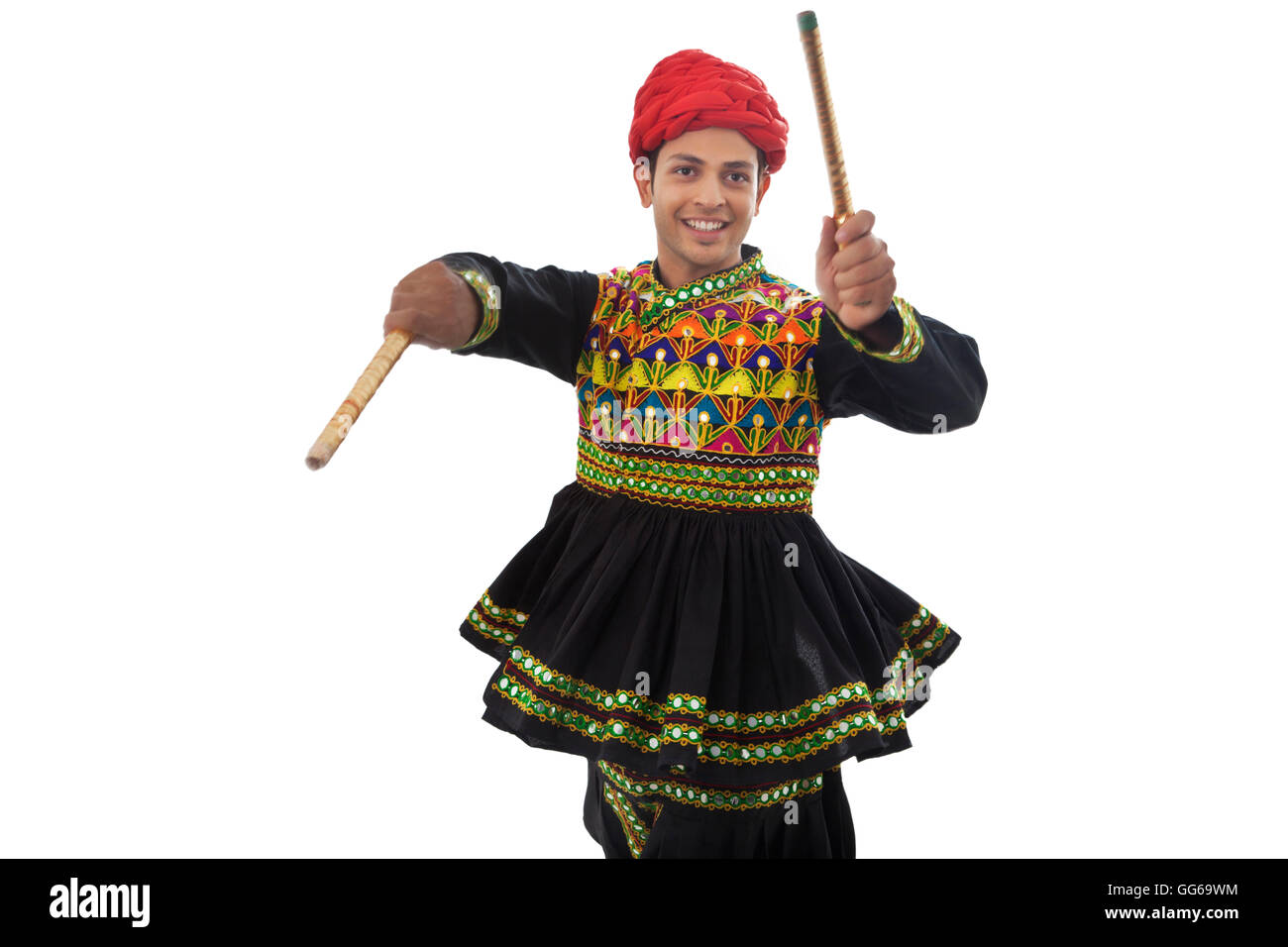 Male dandiya dancer dancing with sticks Stock Photo - Alamy