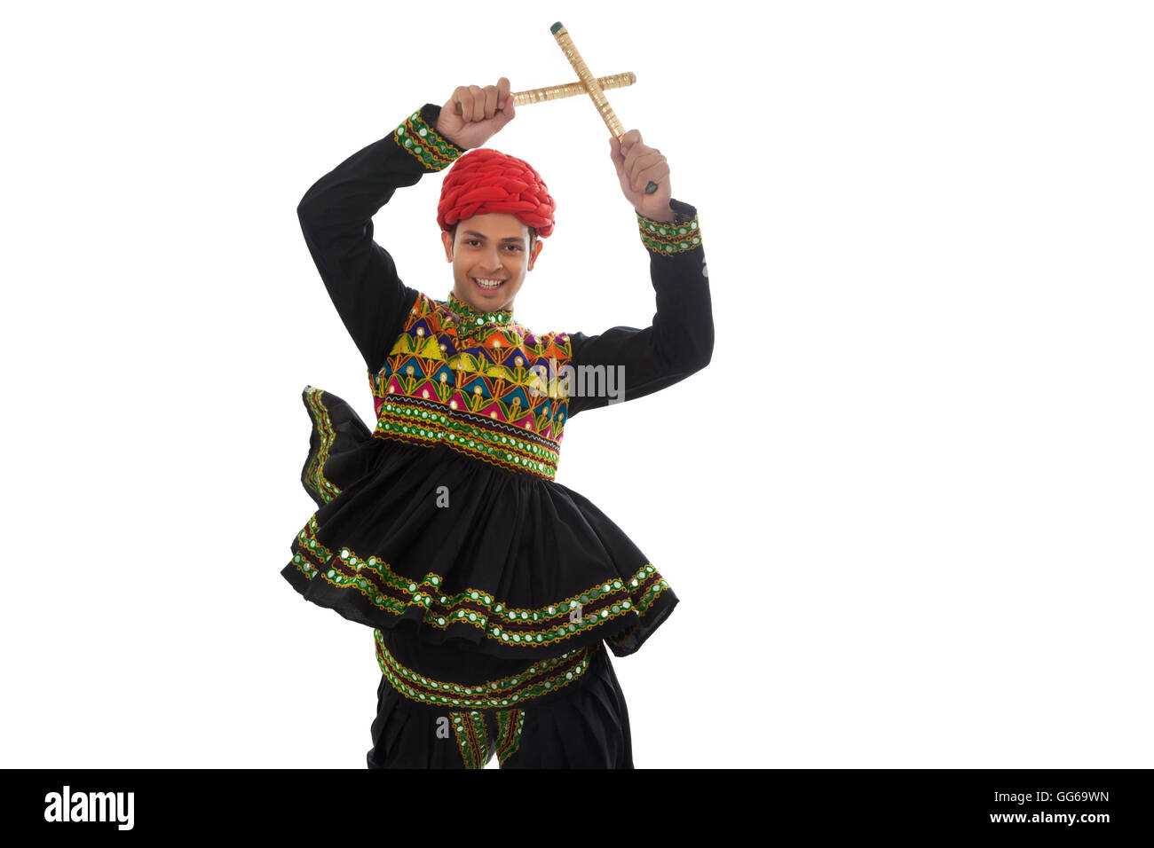 Male dandiya dancer dancing with sticks Stock Photo - Alamy