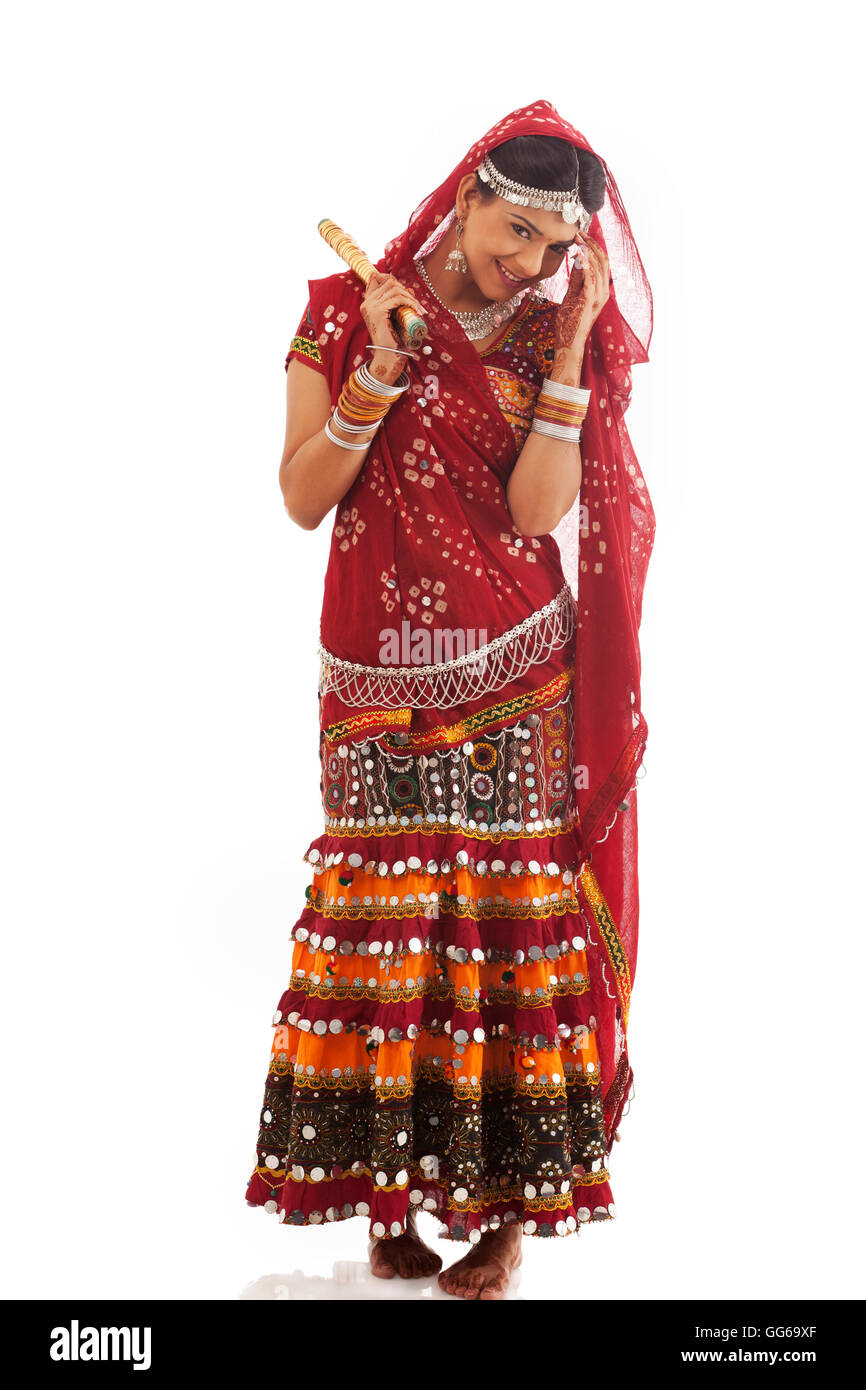 Portrait of a female dandiya dancer with sticks Stock Photo - Alamy