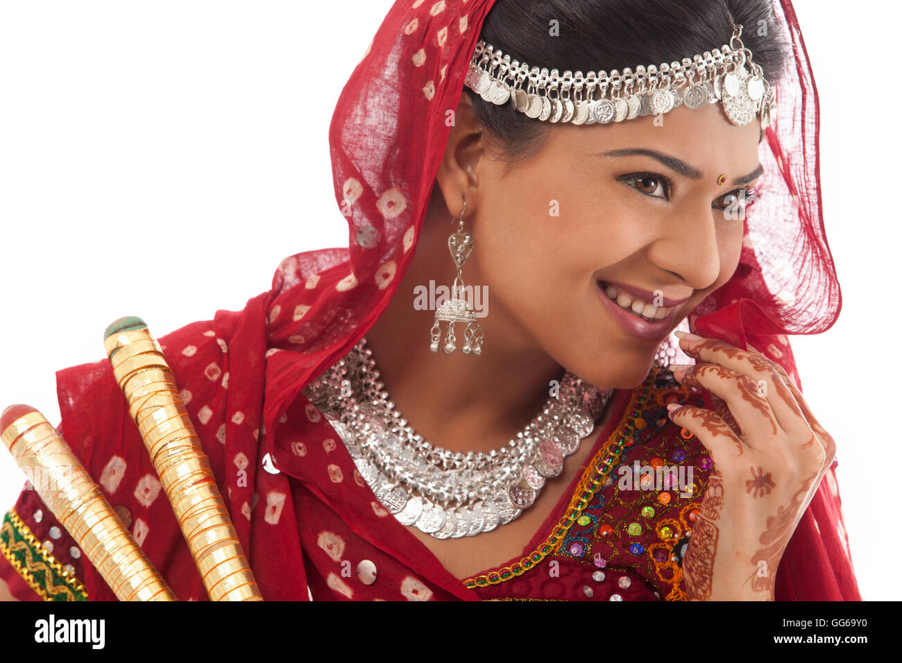Female dandiya dancer with sticks Stock Photo - Alamy