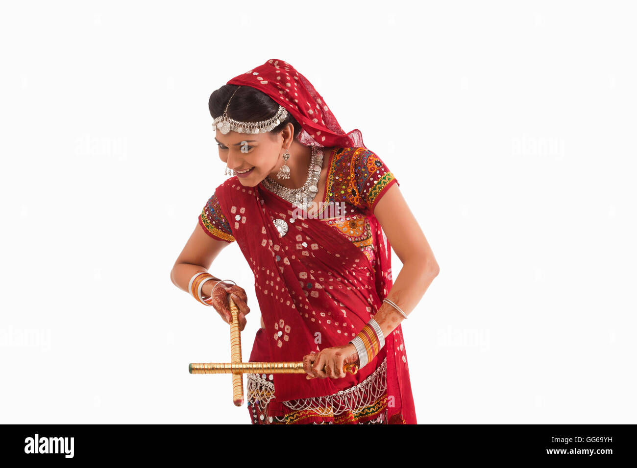 Female dandiya dancer dancing with sticks Stock Photo - Alamy