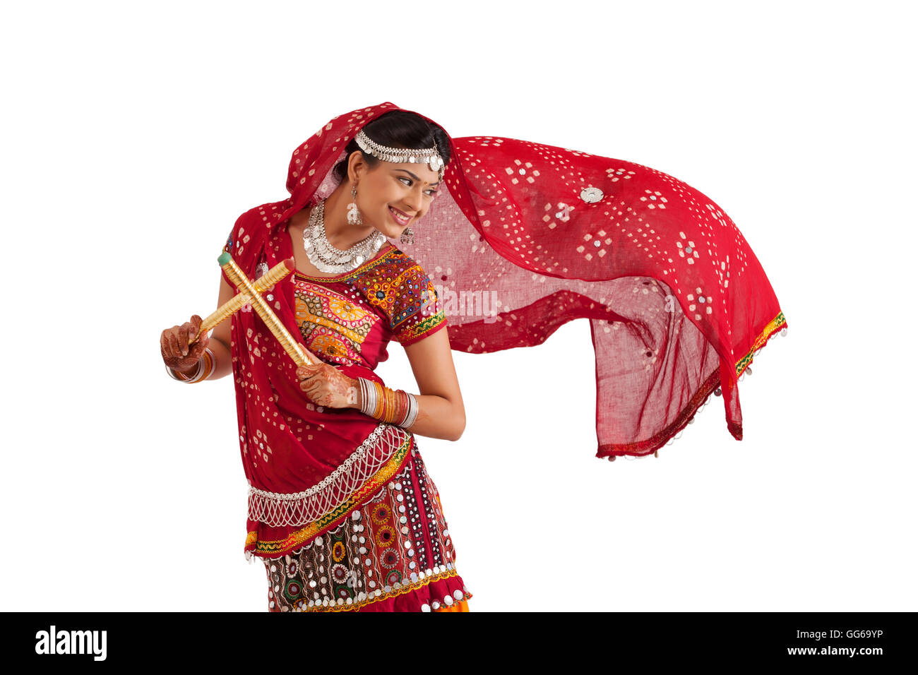 Female dandiya dancer dancing with sticks Stock Photo - Alamy