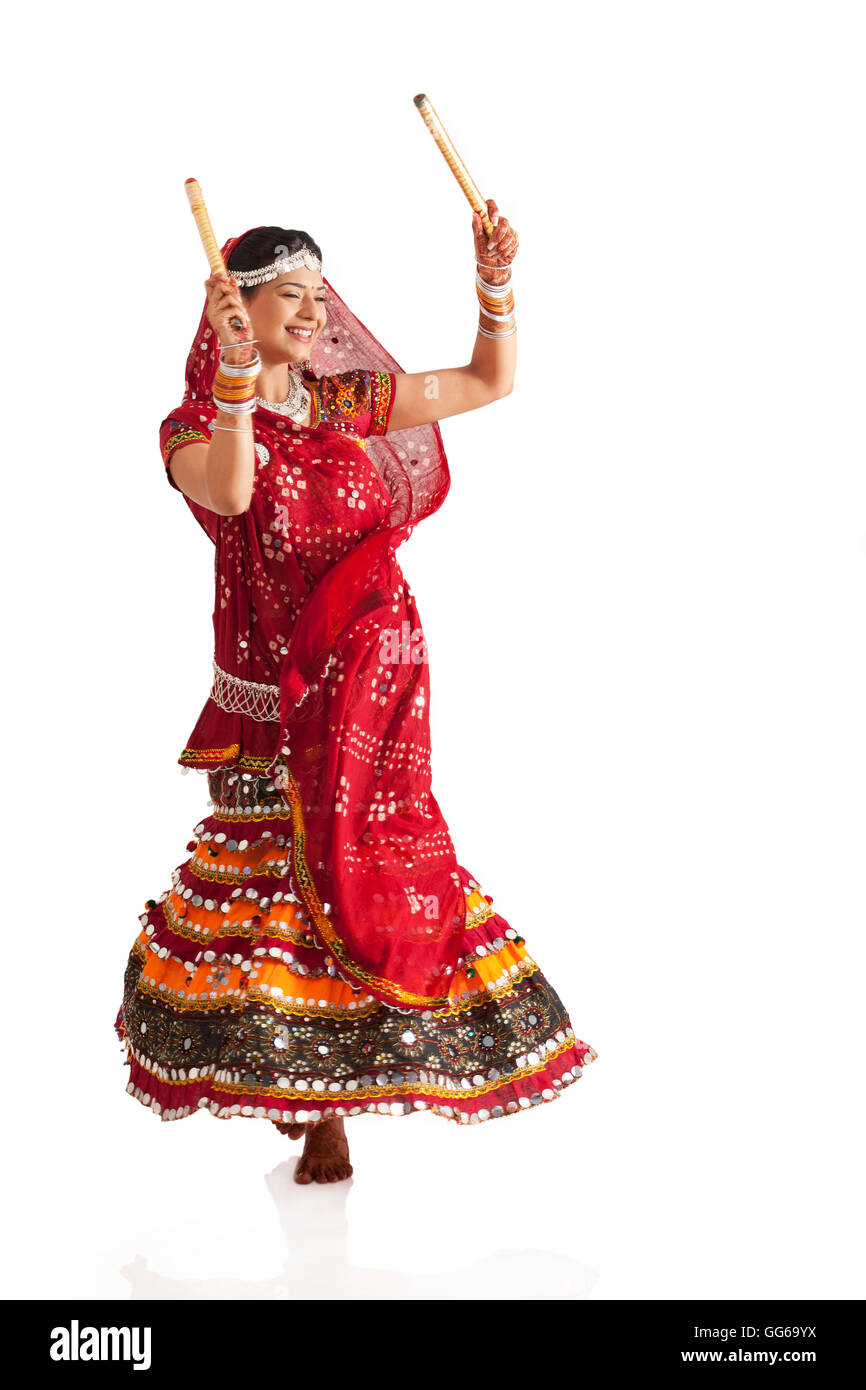 Female dandiya dancer dancing with sticks Stock Photo - Alamy