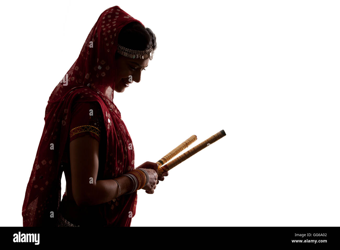 Female dandiya dancer with sticks Stock Photo - Alamy