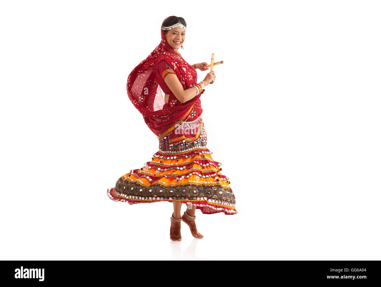 Female dandiya dancer dancing with sticks Stock Photo - Alamy