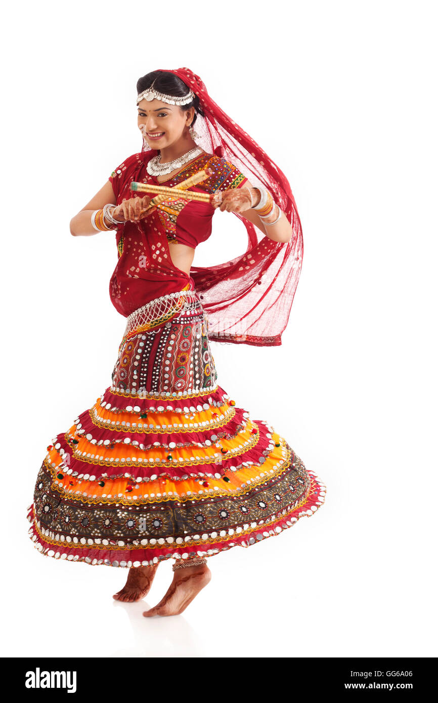 Female dandiya dancer dancing with sticks Stock Photo - Alamy