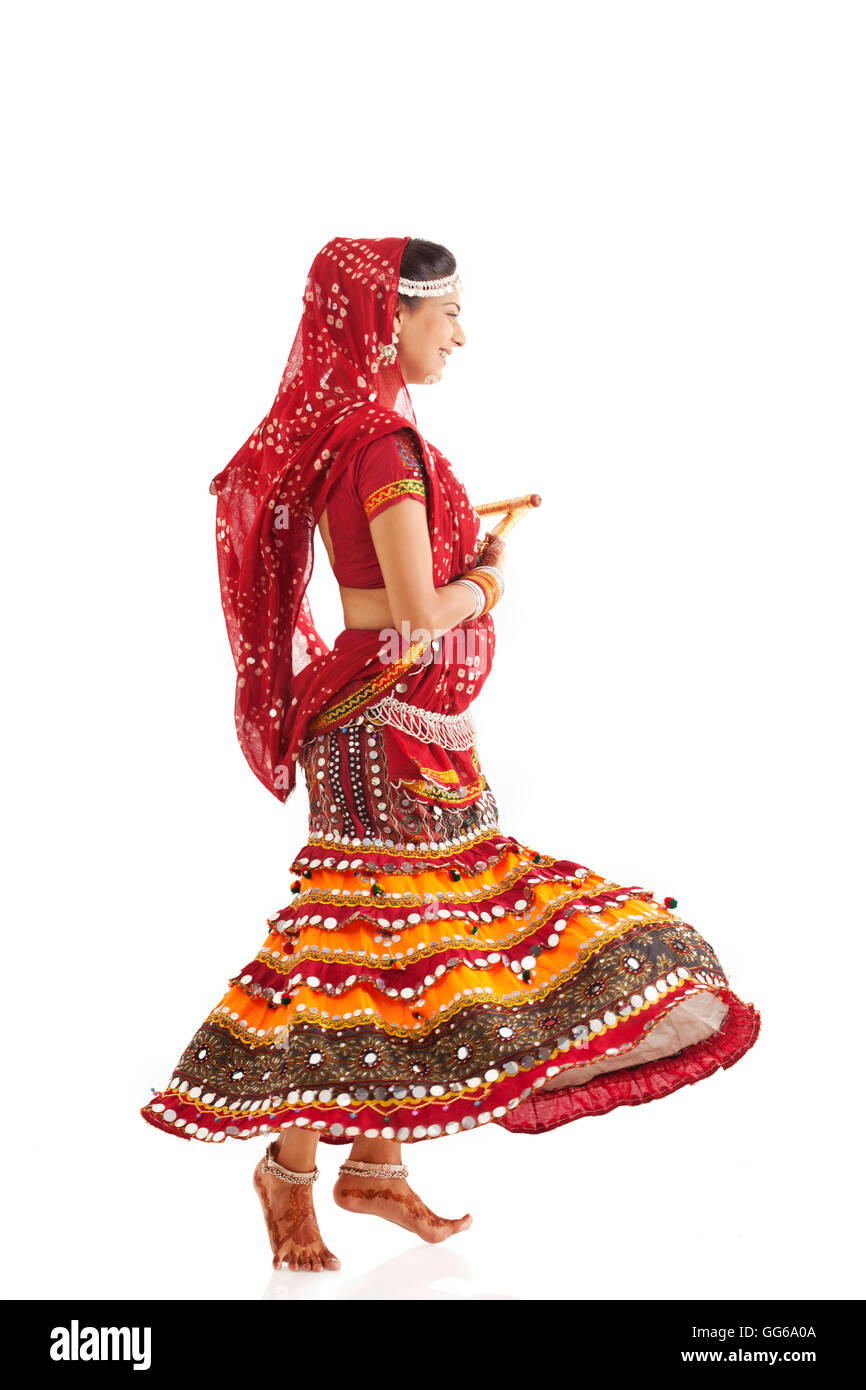Female dandiya dancer dancing with sticks Stock Photo - Alamy