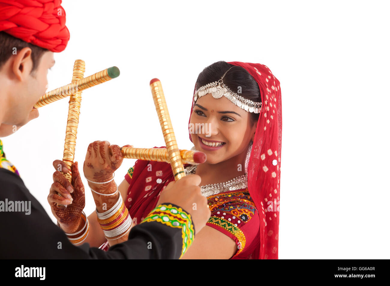 Couple with sticks dancing Stock Photo - Alamy
