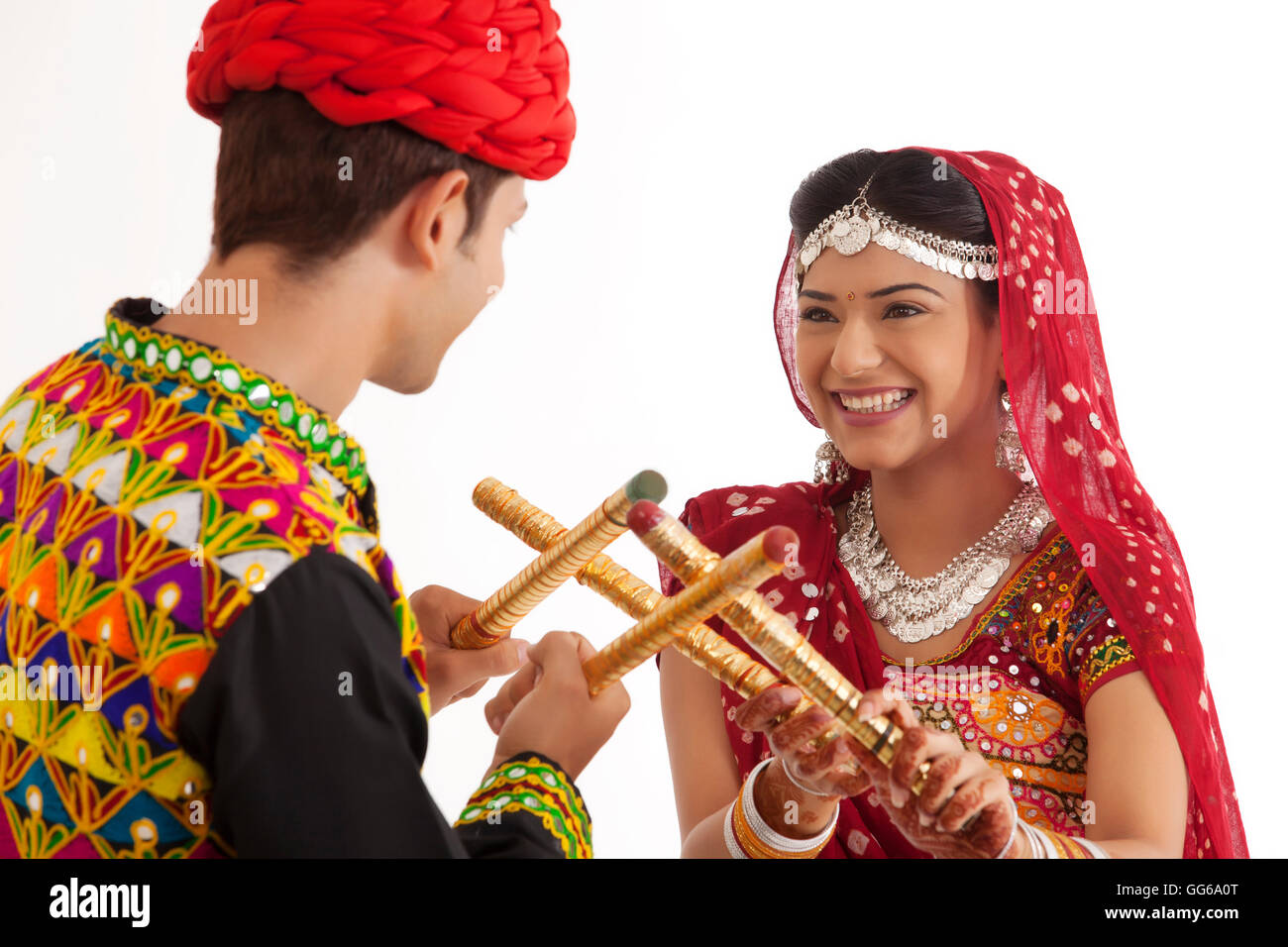 Couple with sticks dancing Stock Photo - Alamy