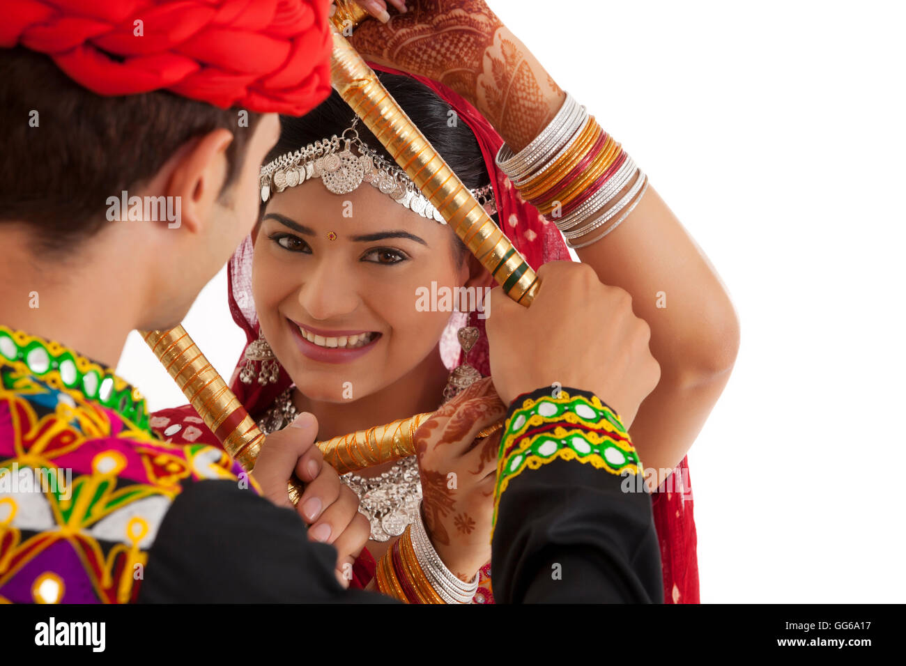 Couple with sticks dancing Stock Photo - Alamy