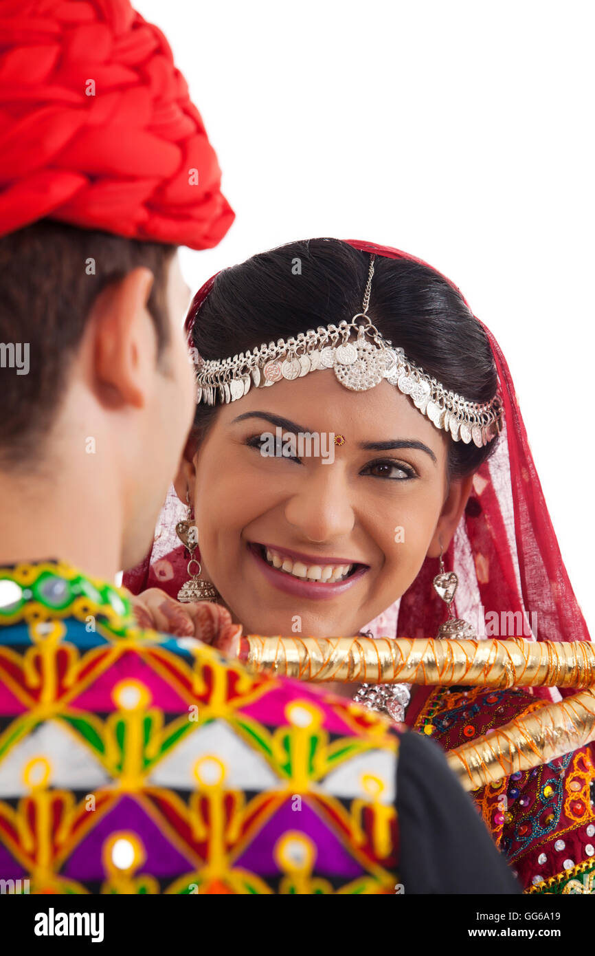 Couple with sticks dancing Stock Photo - Alamy