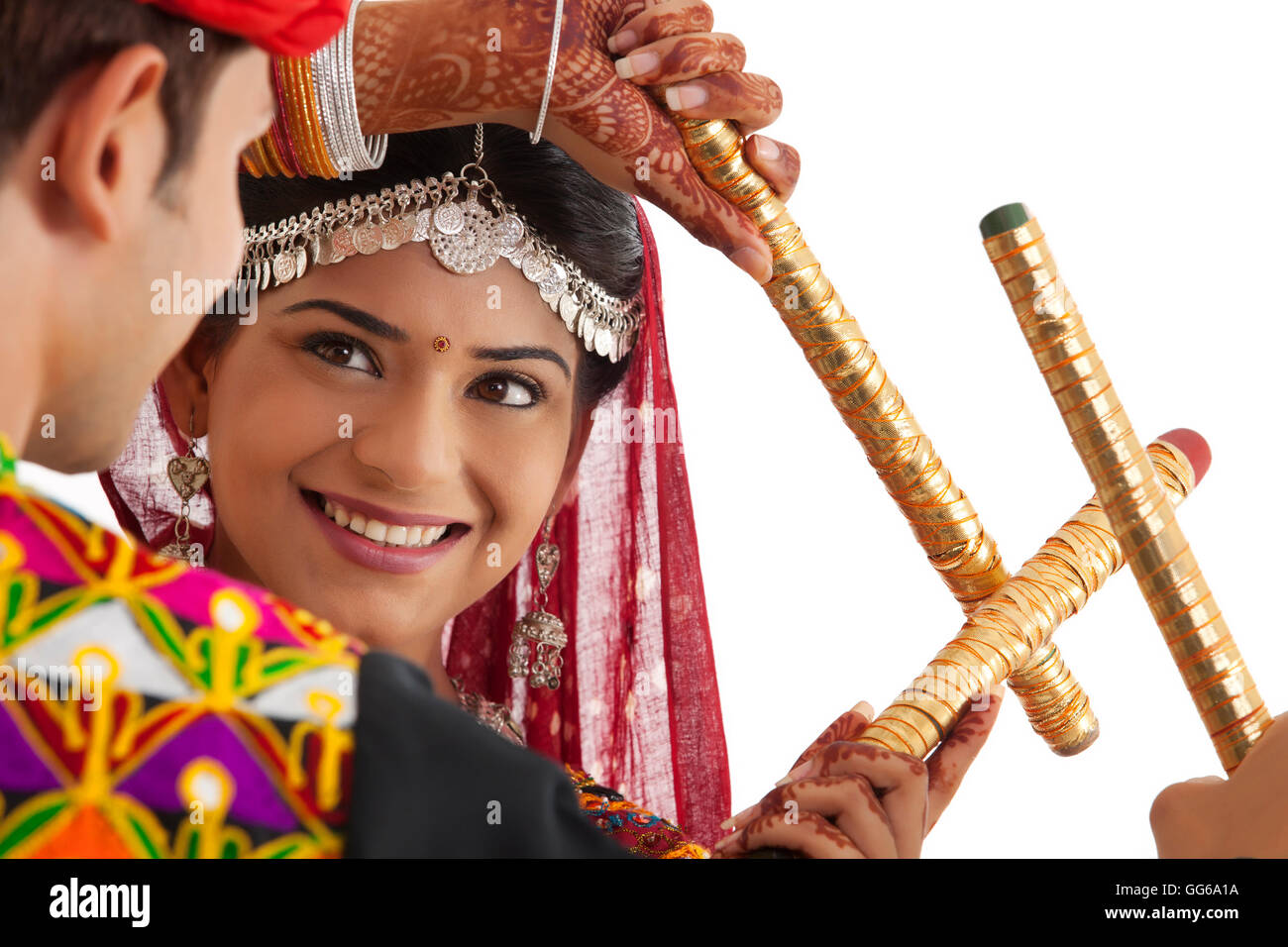 Couple with sticks dancing Stock Photo - Alamy