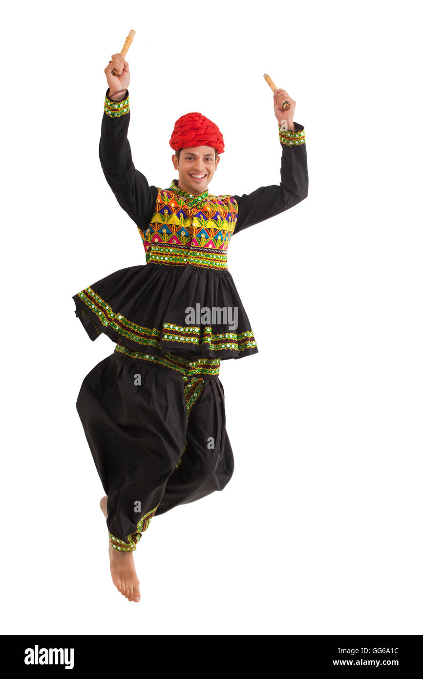 Male dandiya dancer dancing sticks hi-res stock photography and images ...