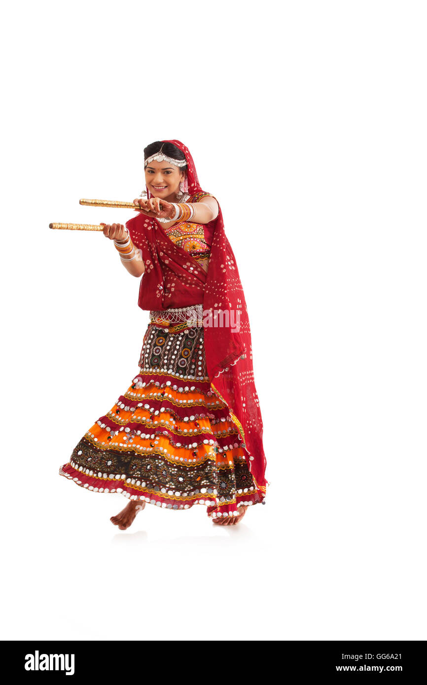 Female dandiya dancer dancing with sticks Stock Photo - Alamy