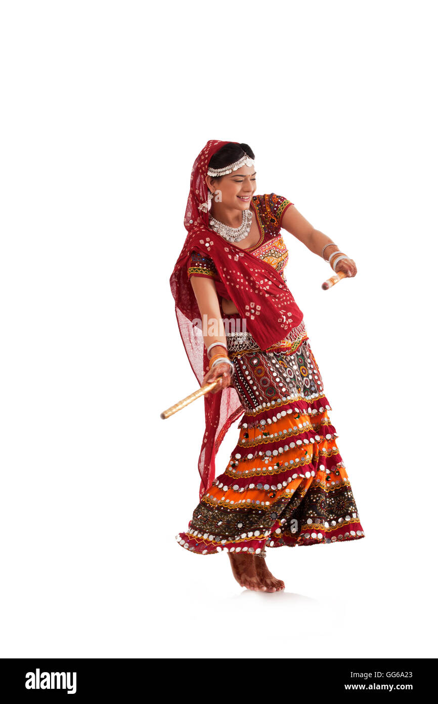 Female dandiya dancer dancing with sticks Stock Photo - Alamy