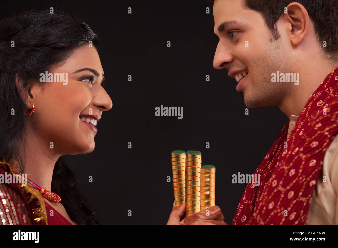 Couple with sticks Stock Photo - Alamy