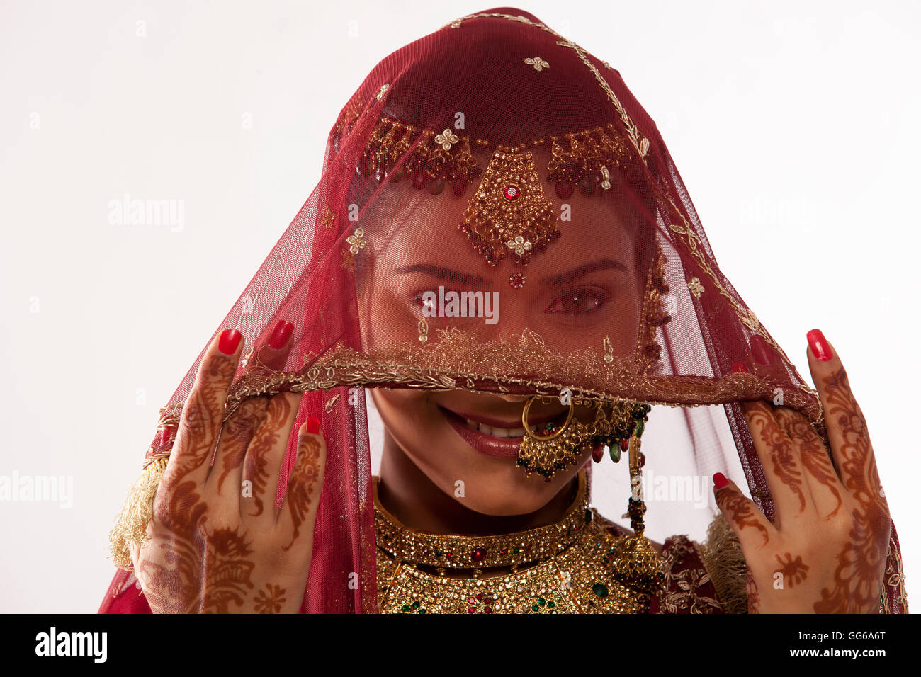 Gujarati brides face hidden behind a veil Stock Photo - Alamy