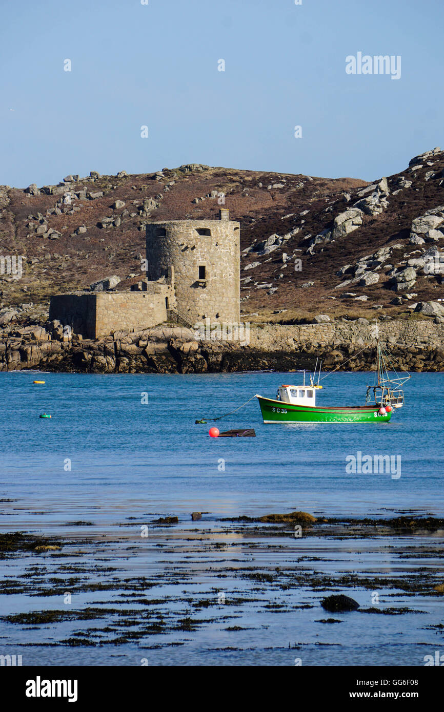 Fishing boat, Cromwell's Castle on Tresco, Isles of Scilly, England ...