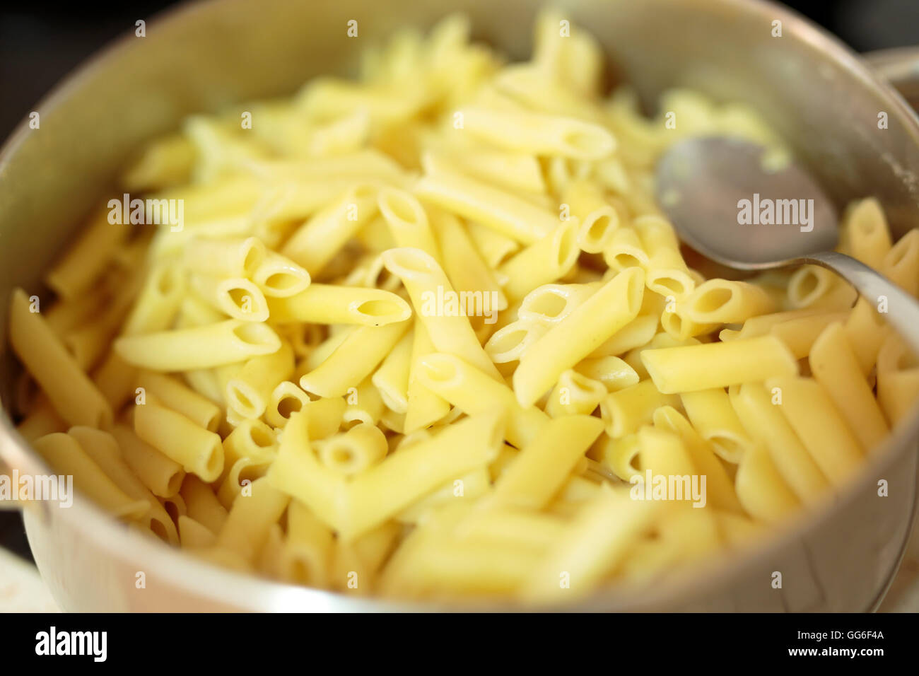 macaroni steamed in a metal pot Stock Photo - Alamy