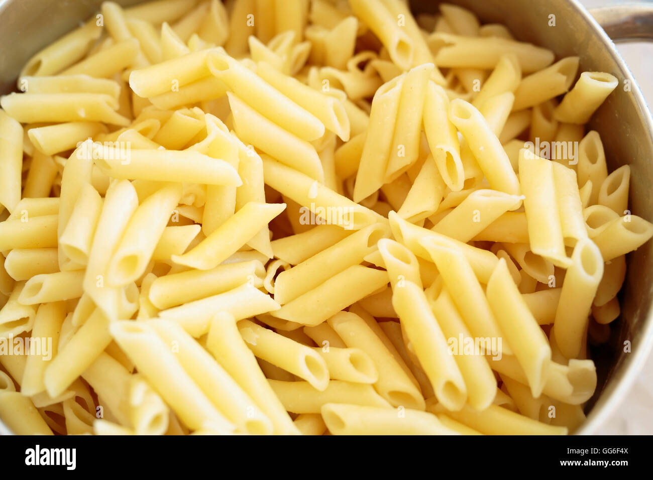 macaroni steamed in a metal pot Stock Photo - Alamy