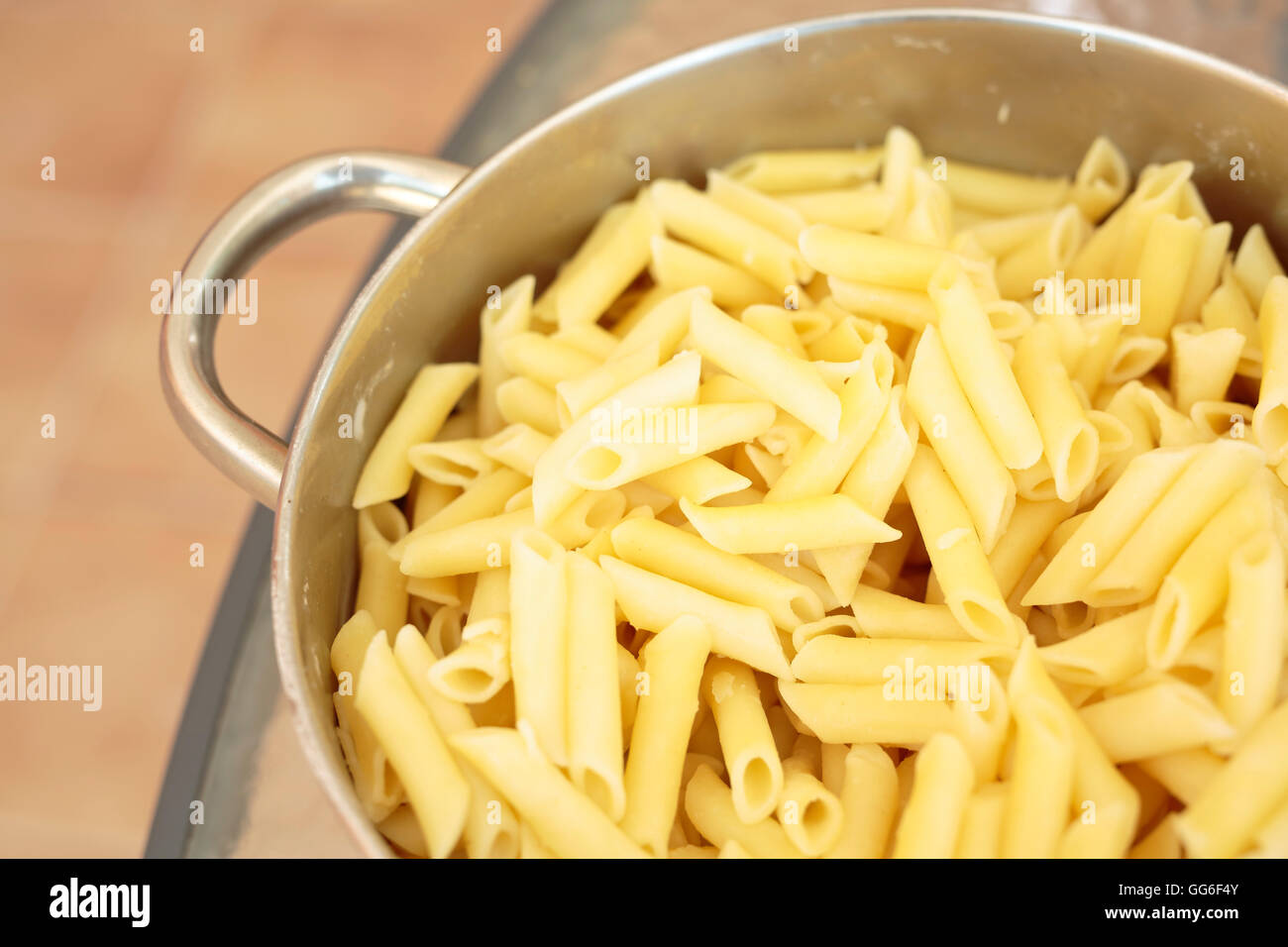 macaroni steamed in a metal pot Stock Photo - Alamy