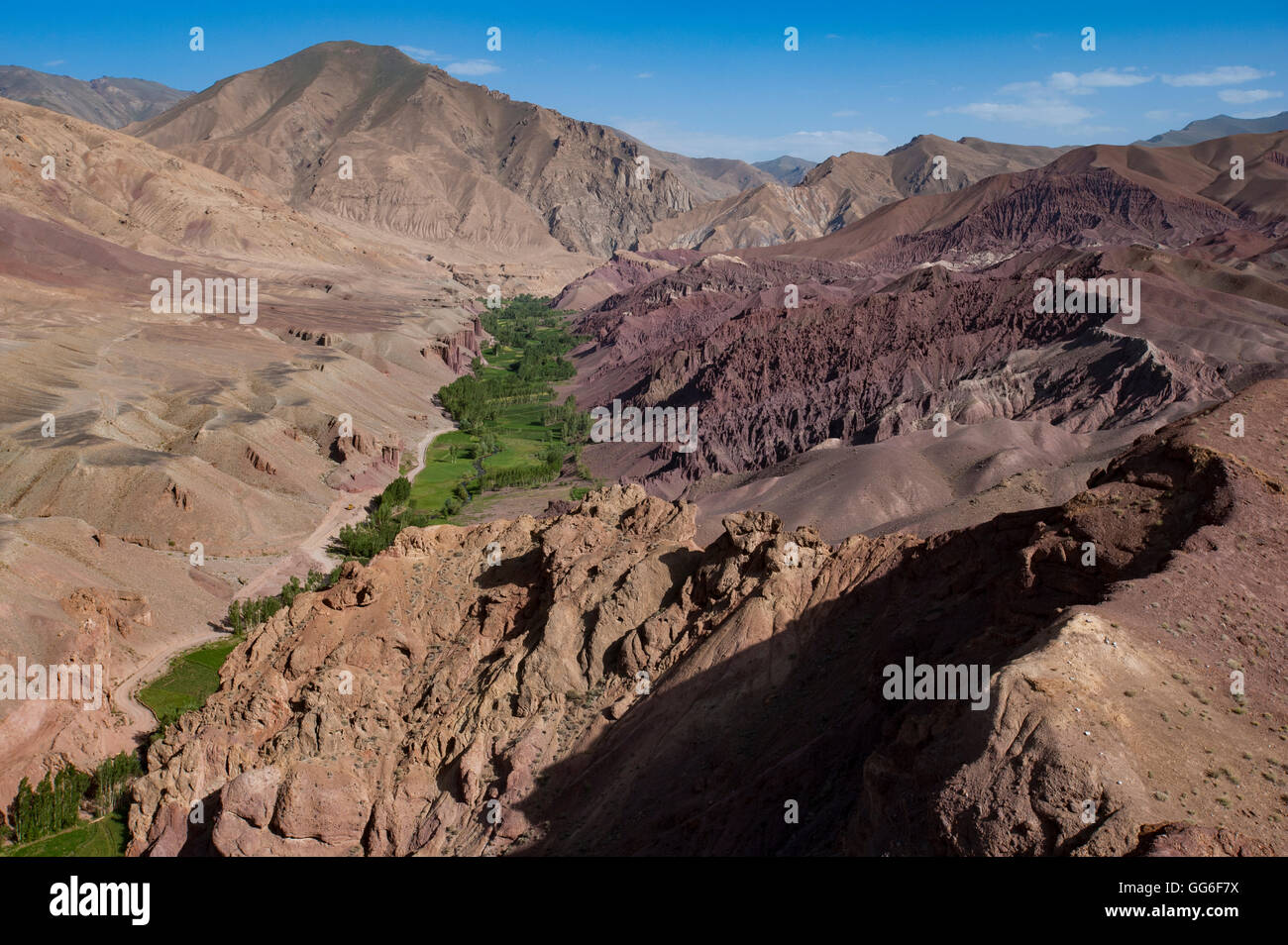 Rugged landscapes and green patchwork fields near Shahr-e Zohak ...