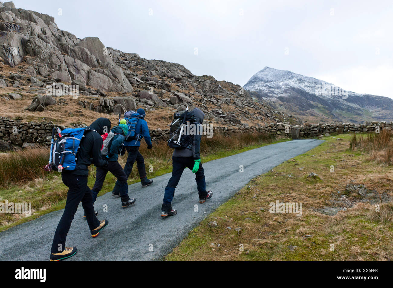 Hikers set off from Pen Y Pass in winter to climb Mount Snowdon in ...