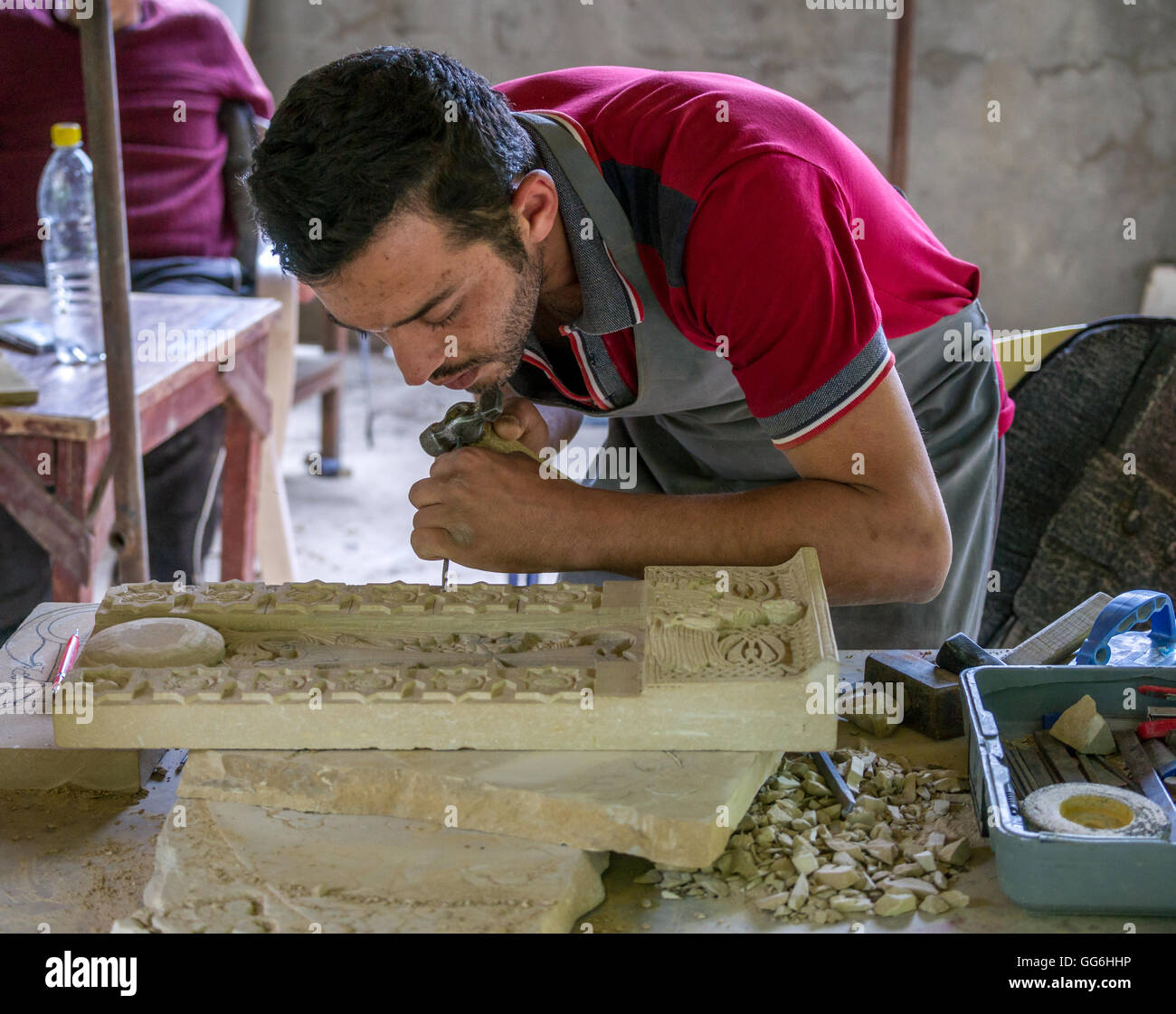 Master carving khachkar.(traditional stone cross) Armenia Stock Photo ...