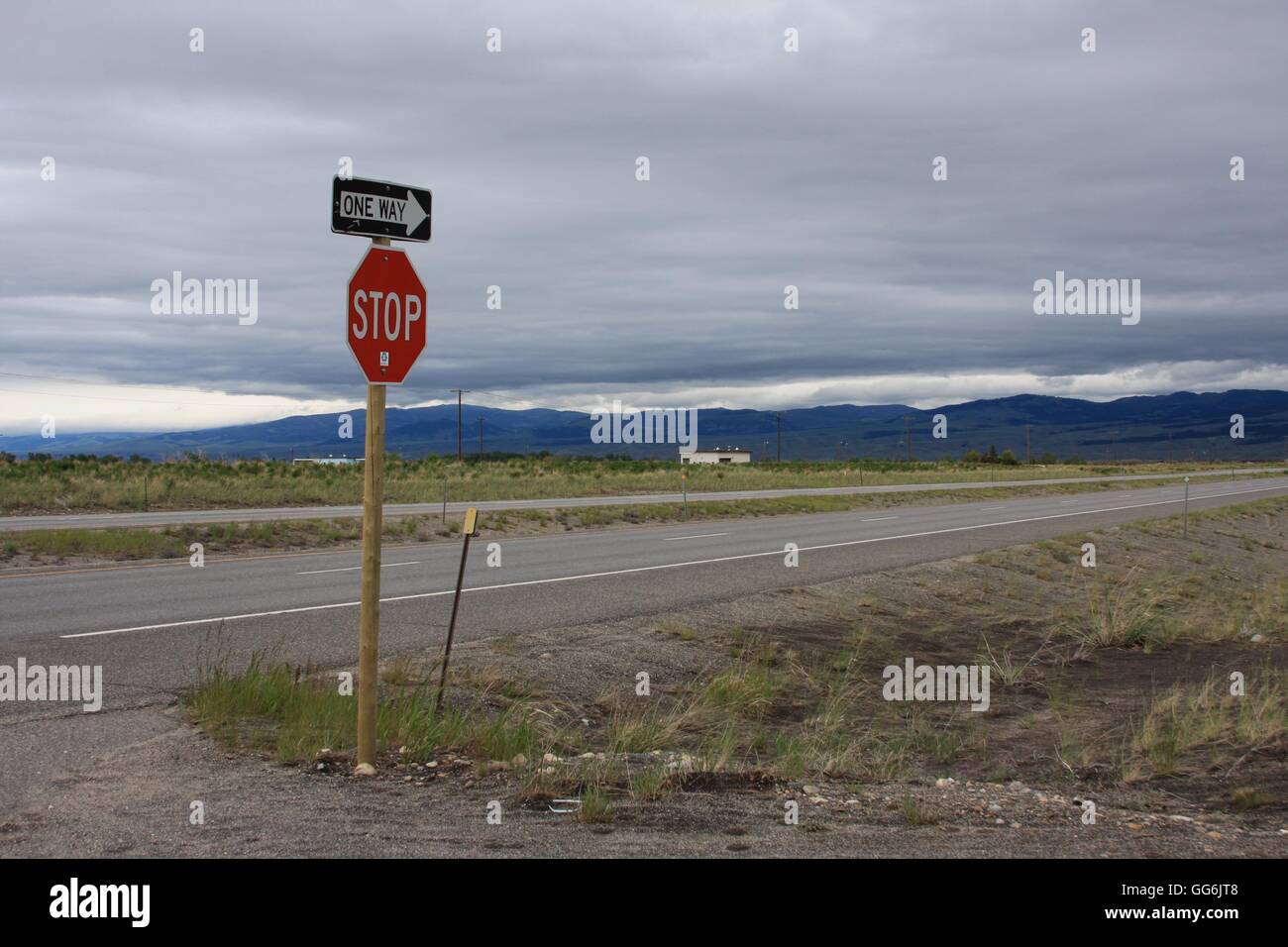 Lonely stop sign on a one way road to nowhere Stock Photo - Alamy