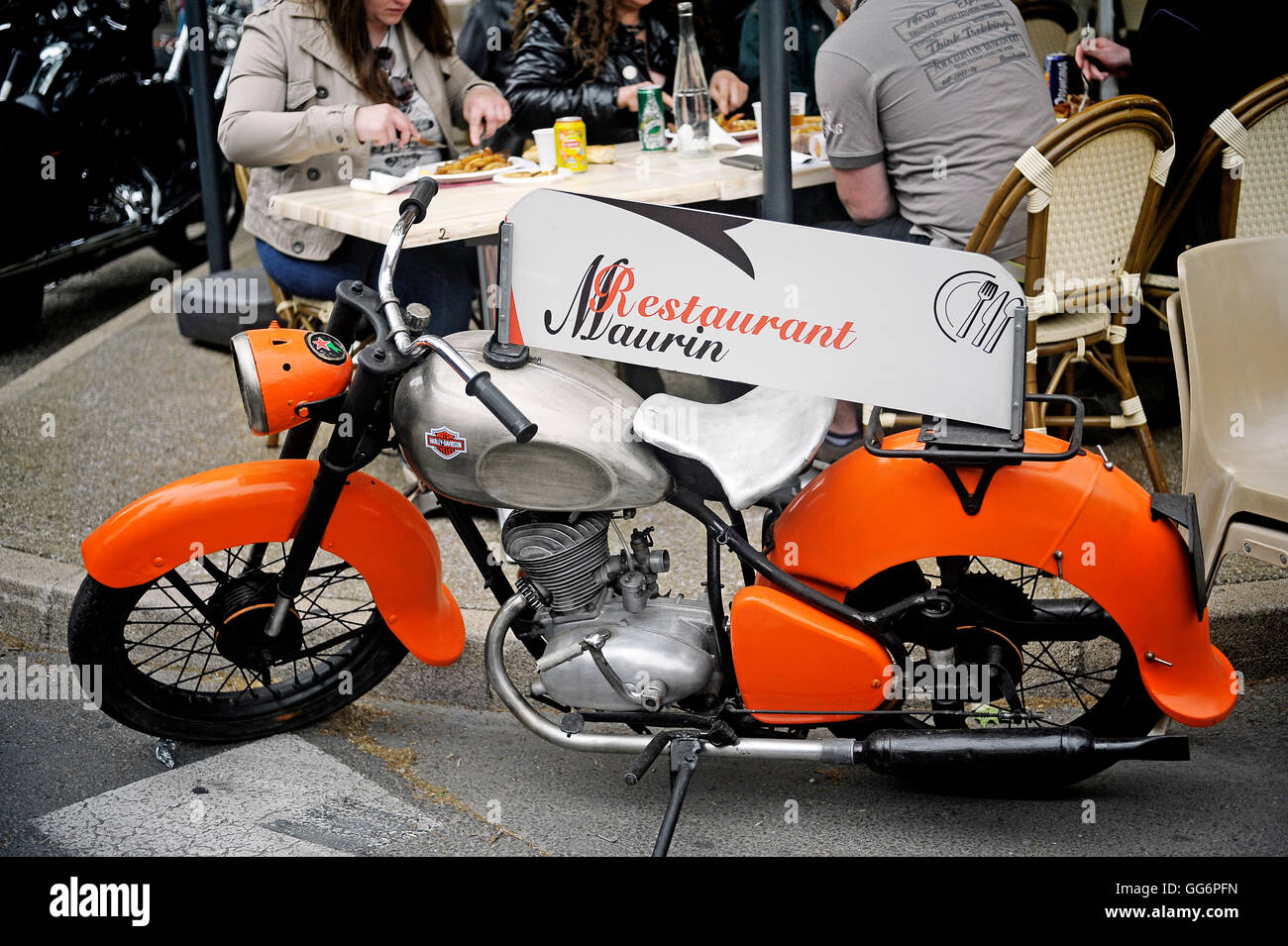 Old motorcycle using menu door in a restaurant in a gathering of ...