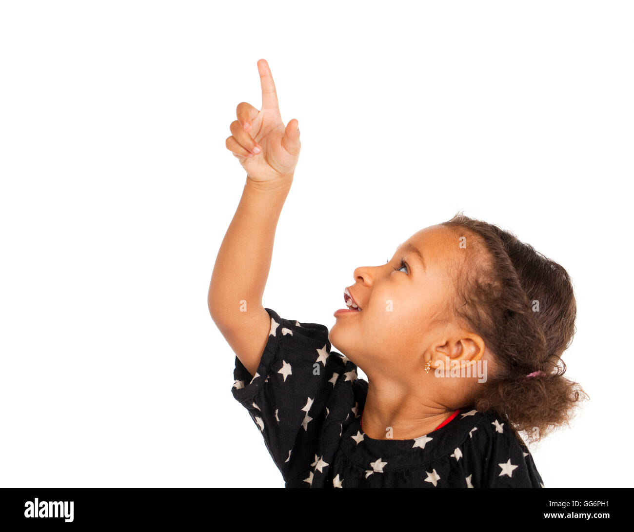 African little girl pointing her finger up, isolated on white Stock ...