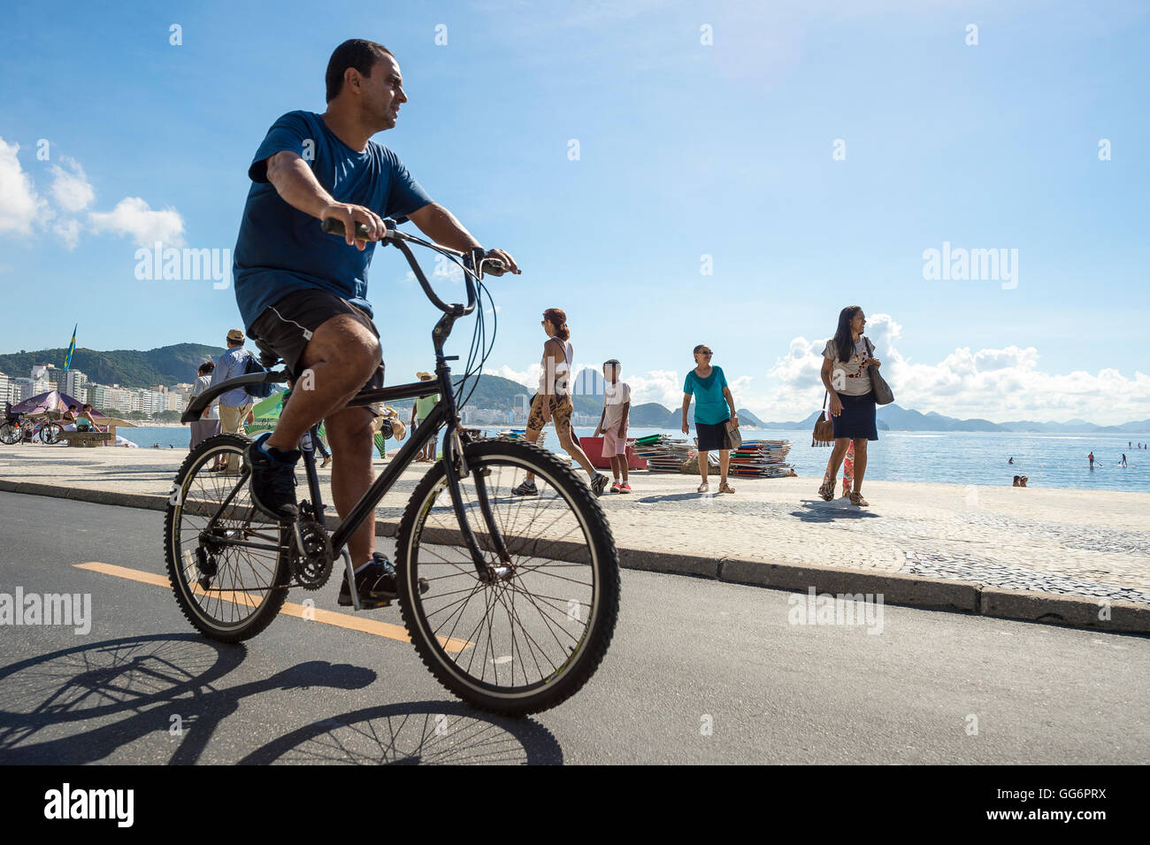 RIO DE JANEIRO - MARCH 20, 2016: Brazilians ride bicycles on the ...