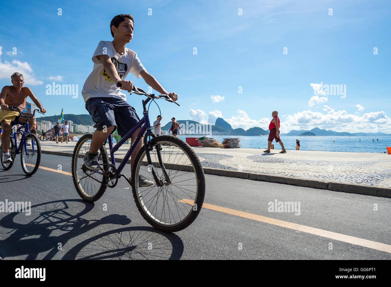 RIO DE JANEIRO - MARCH 20, 2016: Brazilians ride bicycles on the ...