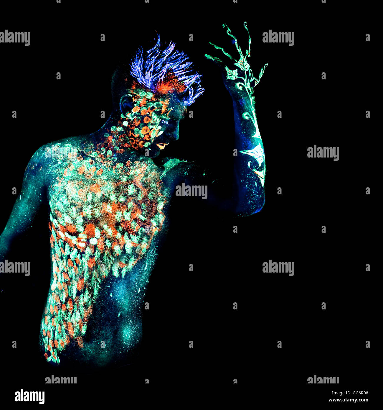 Body art glowing in ultraviolet light Stock Photo - Alamy