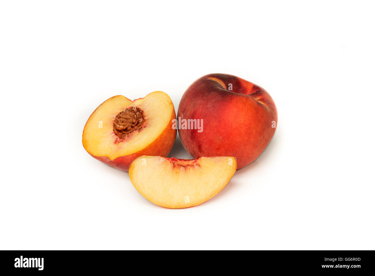 a peach, a half and a quarter on white background Stock Photo - Alamy
