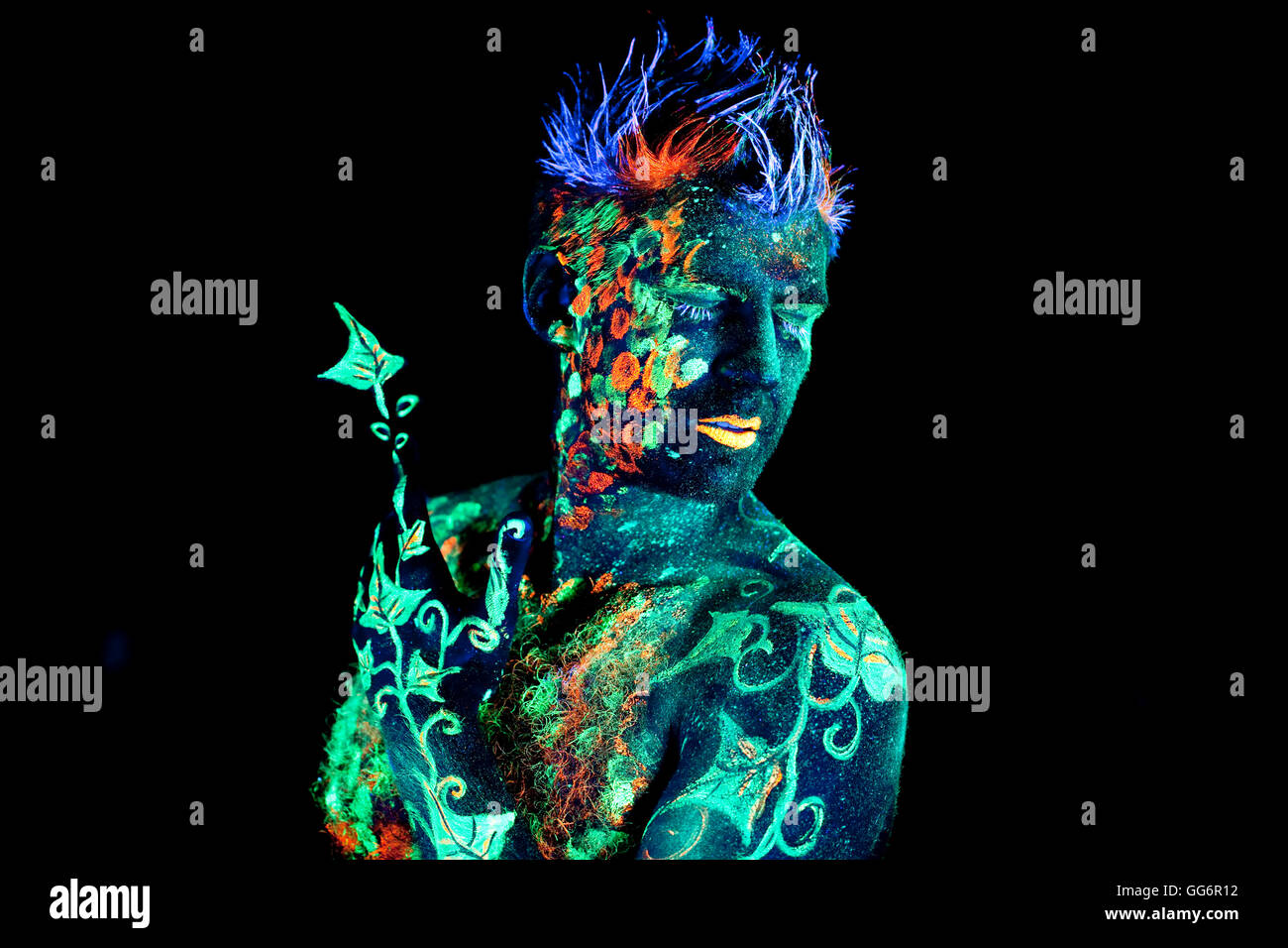 Body art glowing in ultraviolet light Stock Photo - Alamy