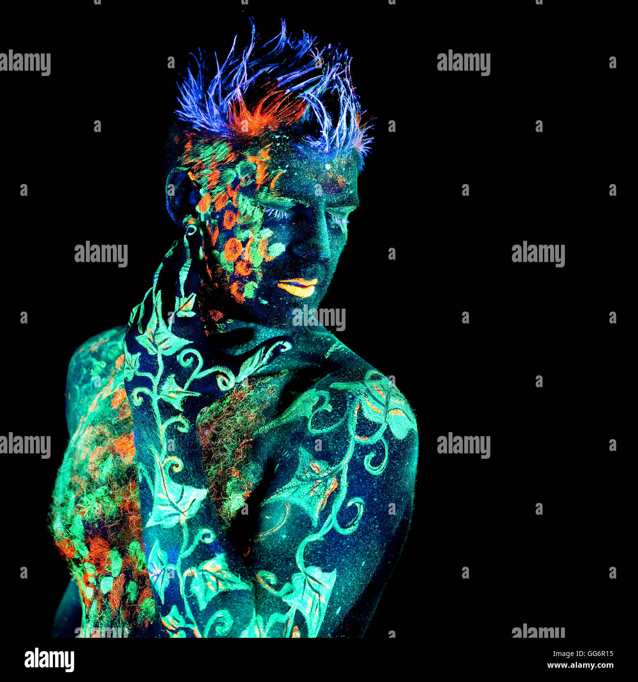 Body art glowing in ultraviolet light Stock Photo - Alamy