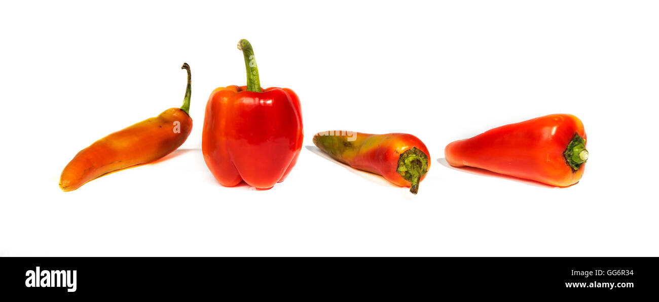 four red peppers of different shapes on white background Stock Photo ...