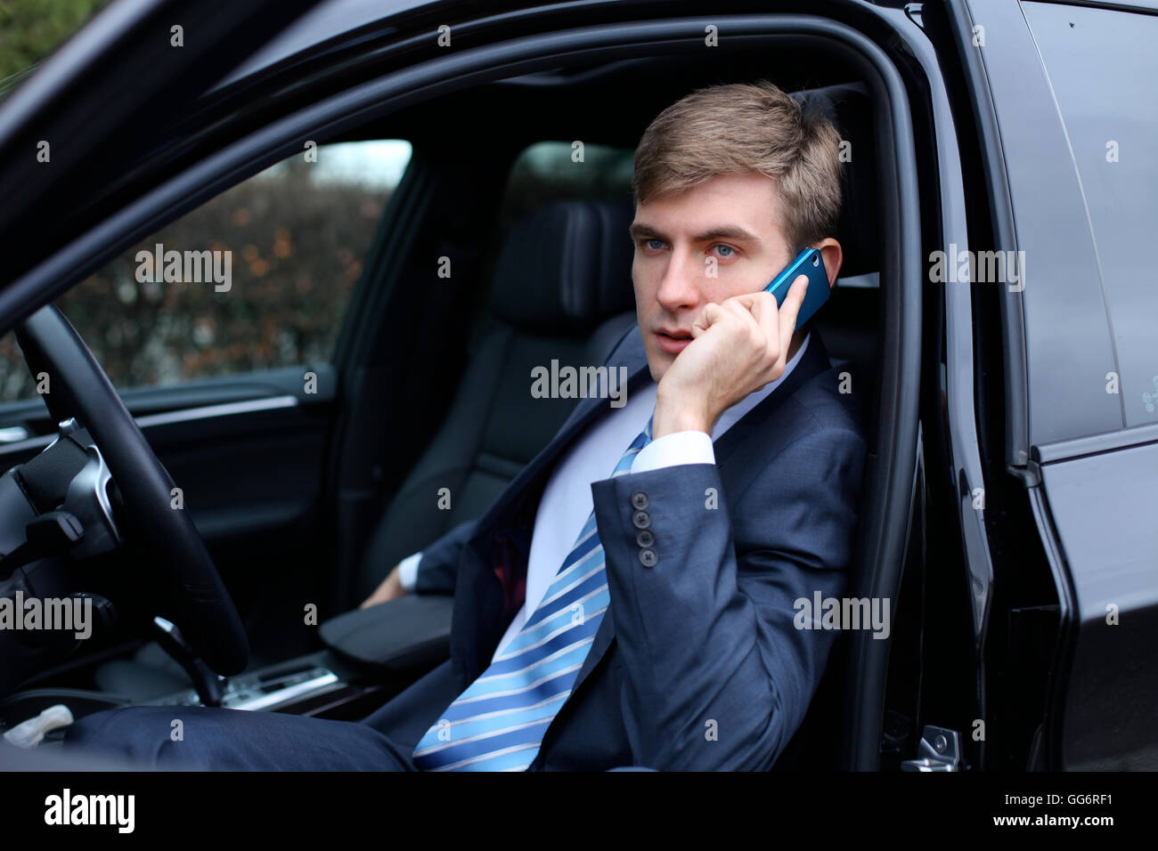 Portrait of young attractive man calling by phone Stock Photo - Alamy