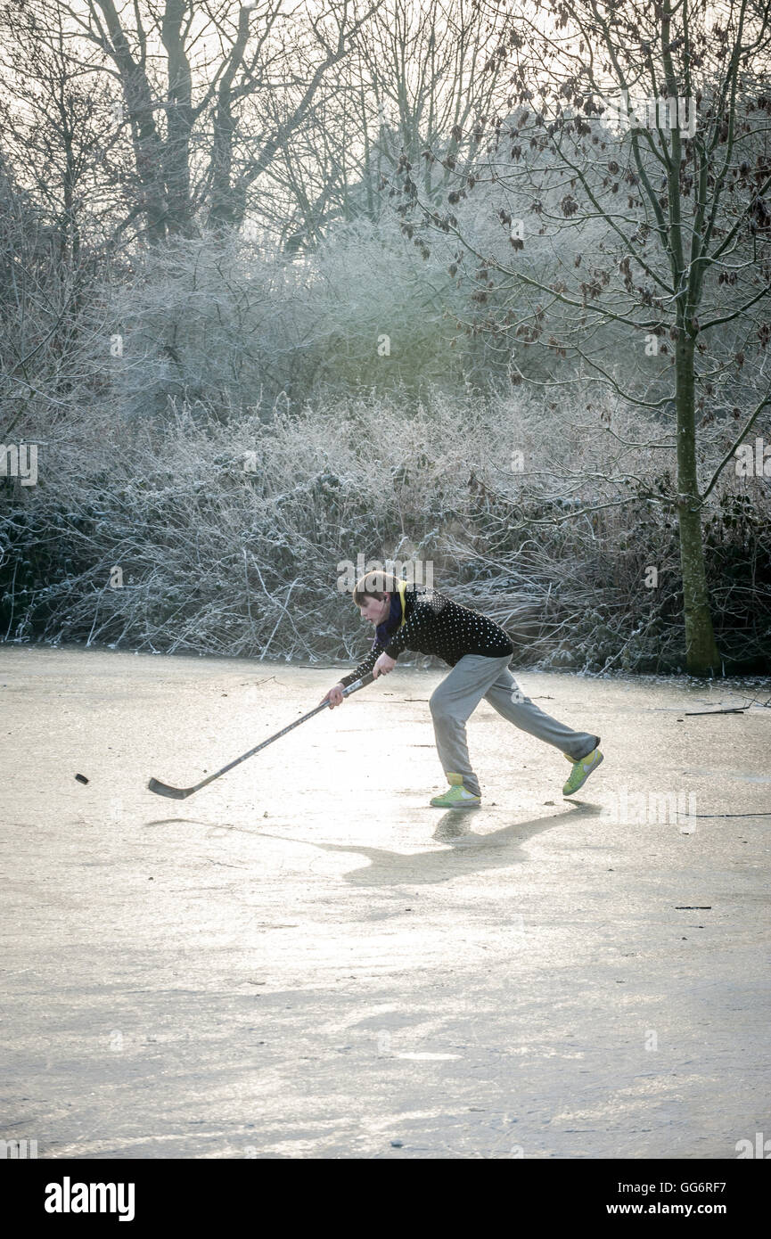Locals take advantage of conditions by ice-skating on a frozen pond at ...