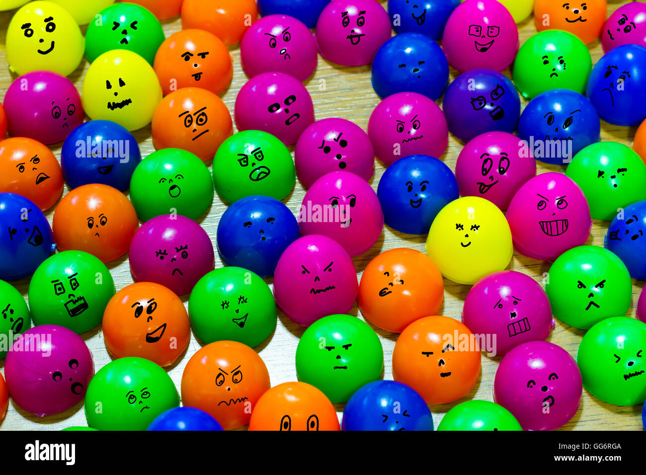 Differences faces on plastic eggs living together Stock Photo - Alamy