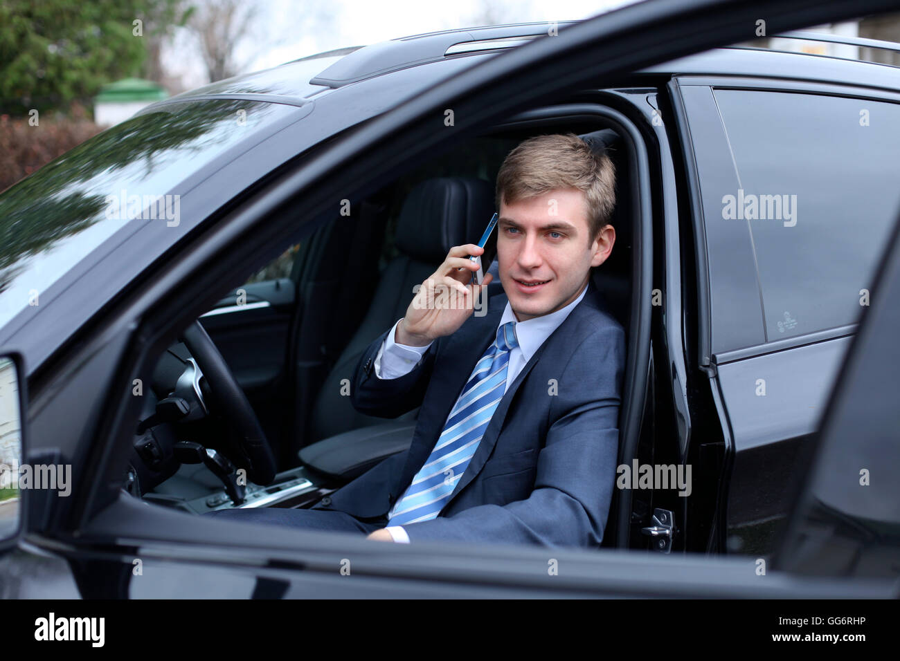 Portrait of young attractive man calling by phone Stock Photo - Alamy